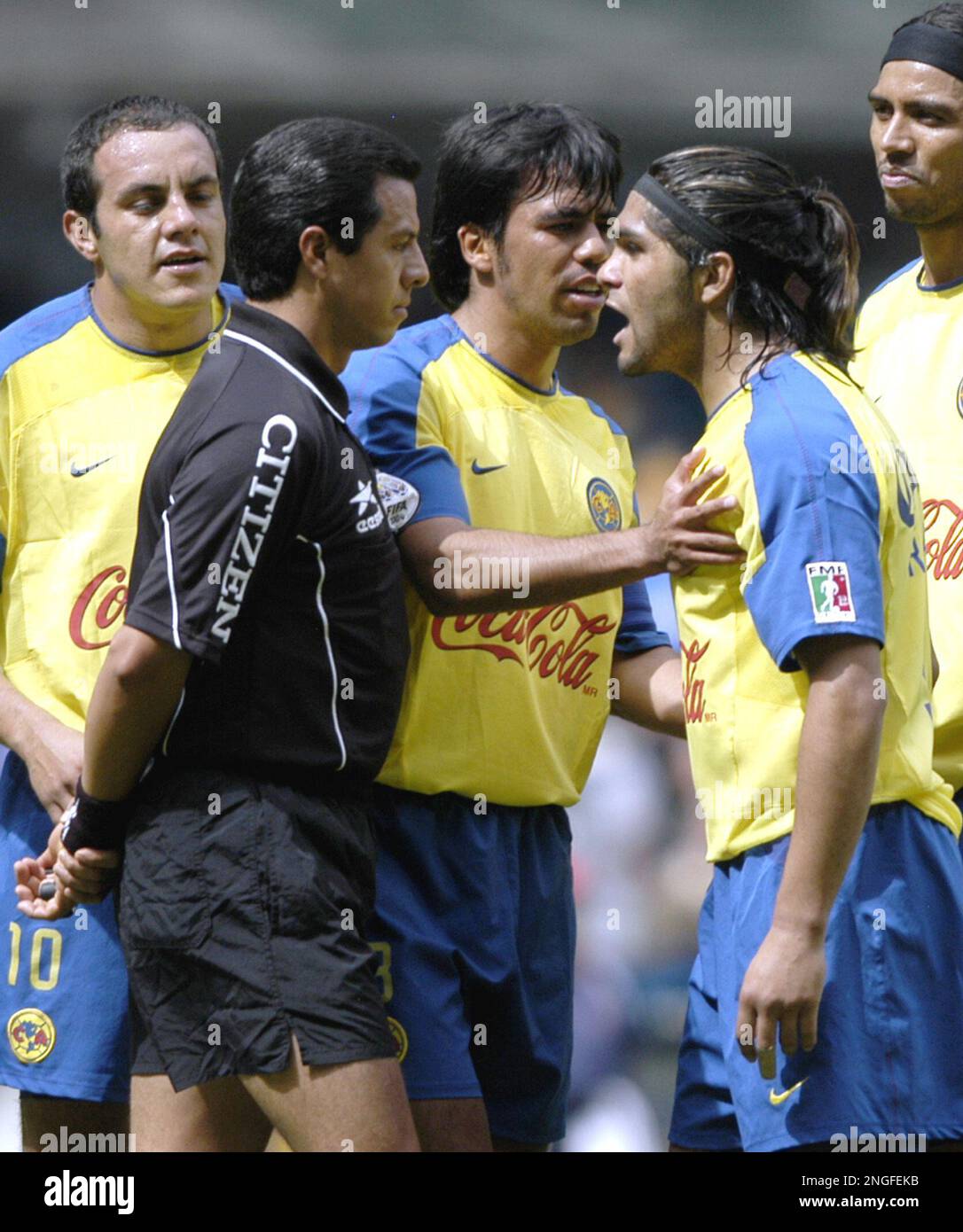 America's soccer player Reinaldo Navia, right, is sent out by referee ...
