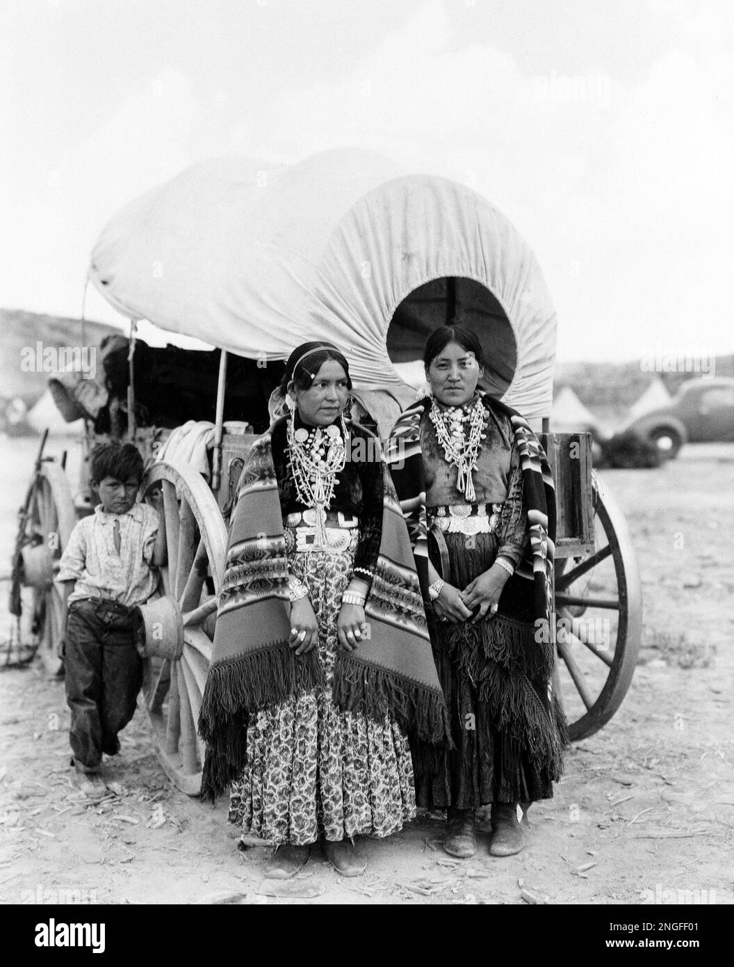 The Navajo women, observing the rule of wearing traditional Navajo ...