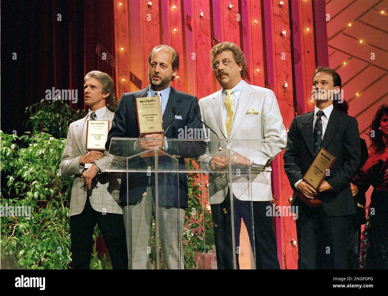 The Statler Brothers, Phil Balsley, Don Reid, Harold Reid, and Jimmy Fortune, from left, accept ...