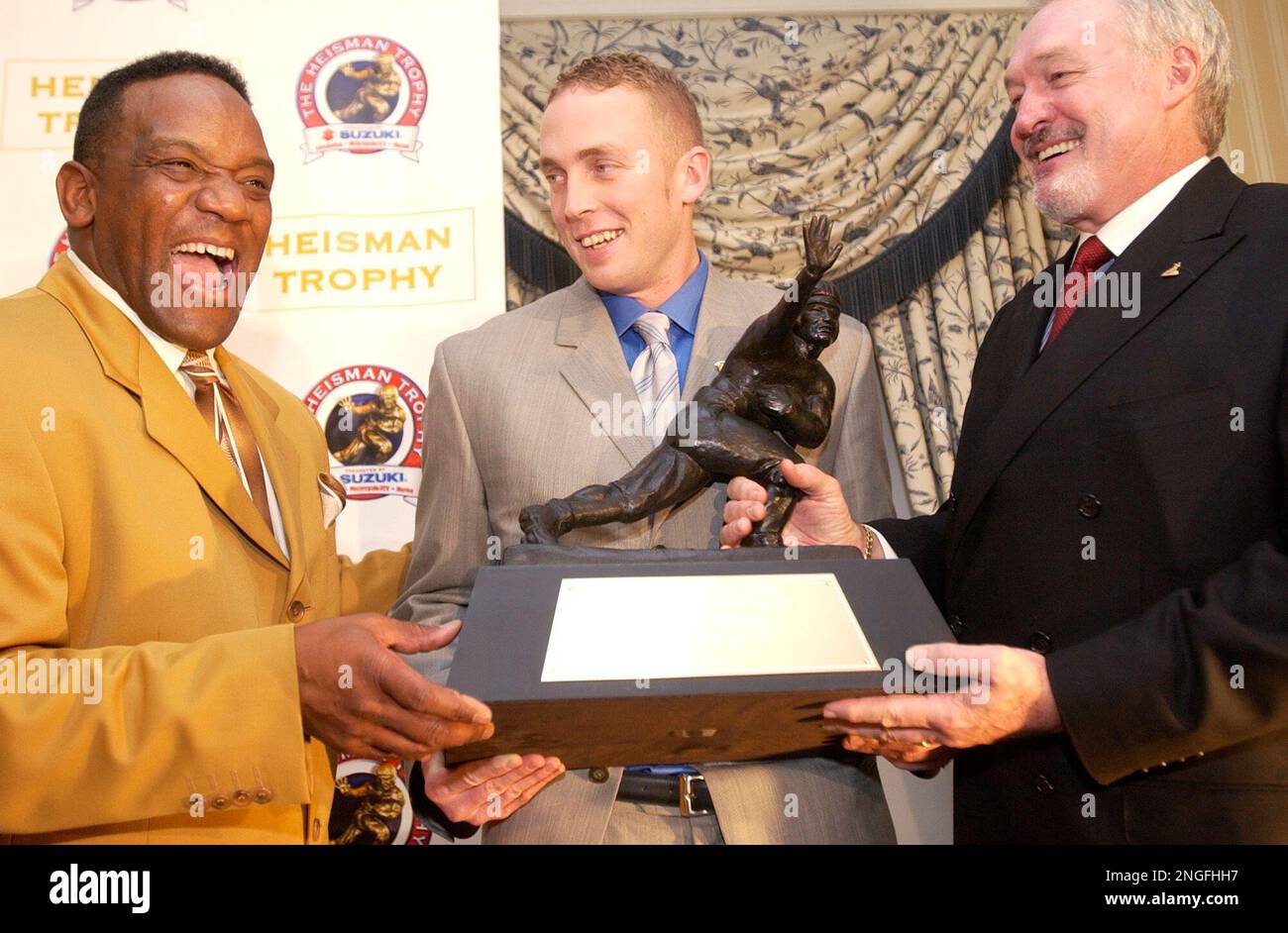 Heisman Trophy winner Jason White, center, a quarterback from Oklahoma ...