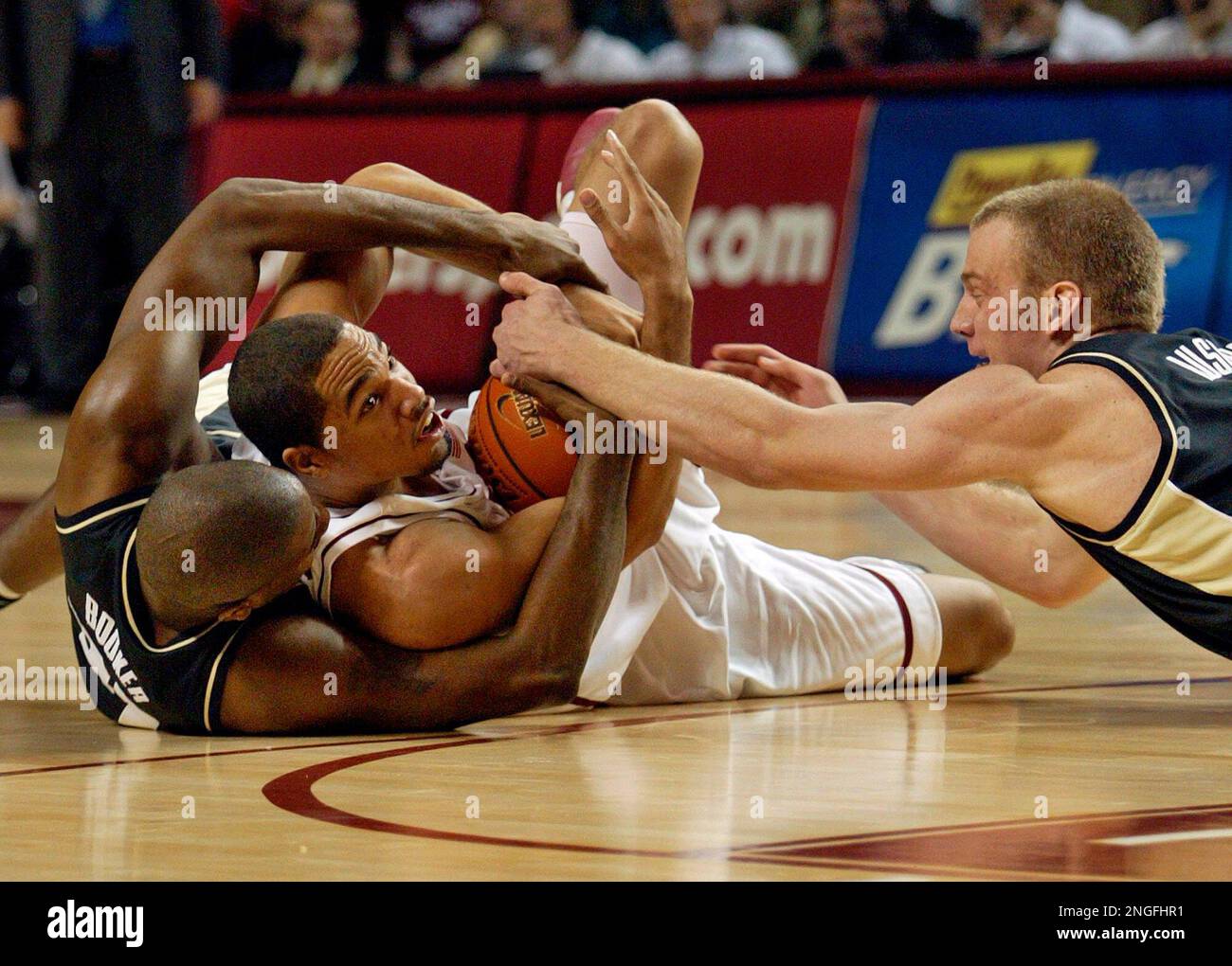 Purdue forward Chris Booker, left, and forward Brett Buscher, right ...