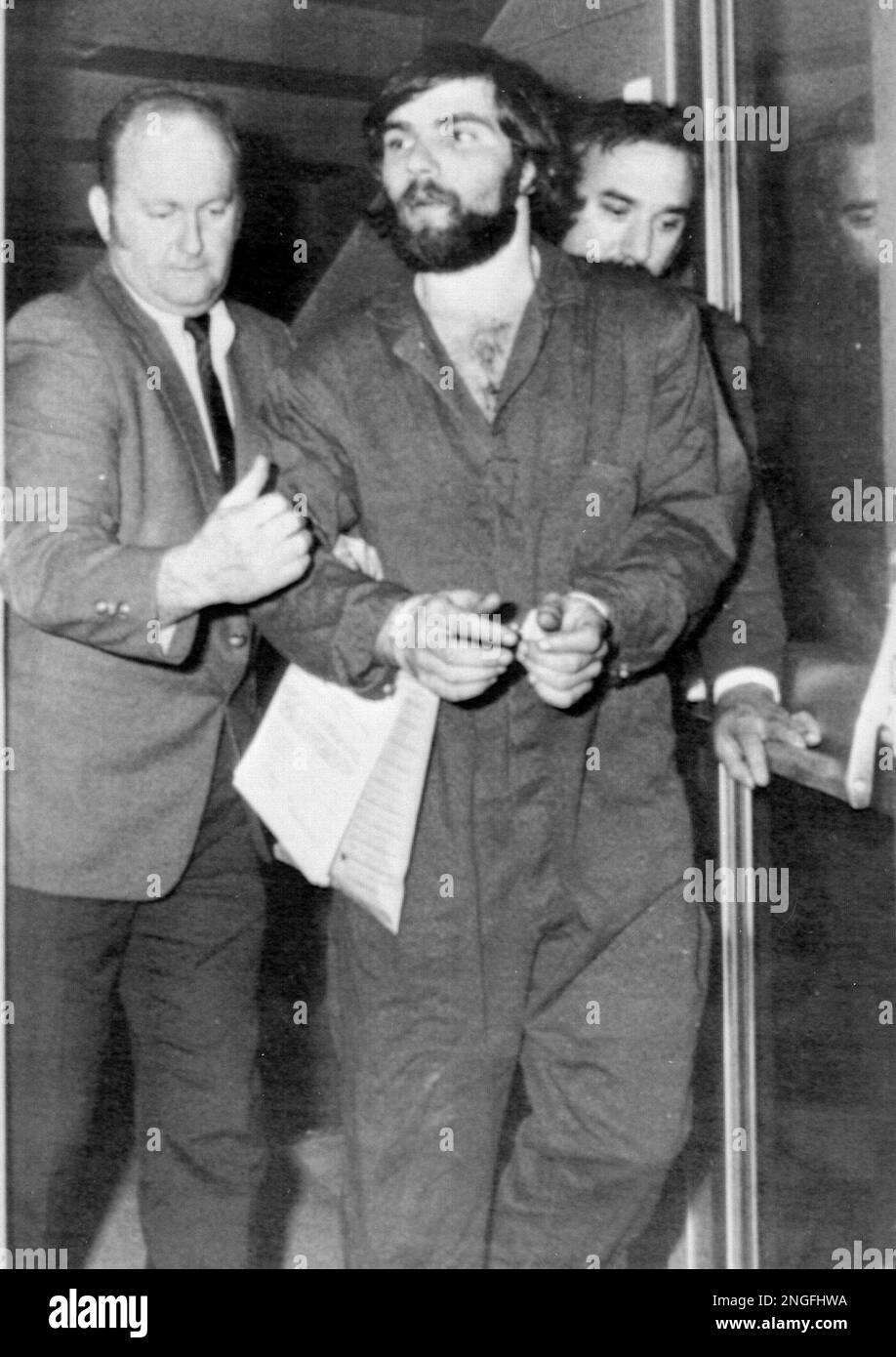 Ronald DeFeo Jr., 23, centre, is escorted by police officers after ...