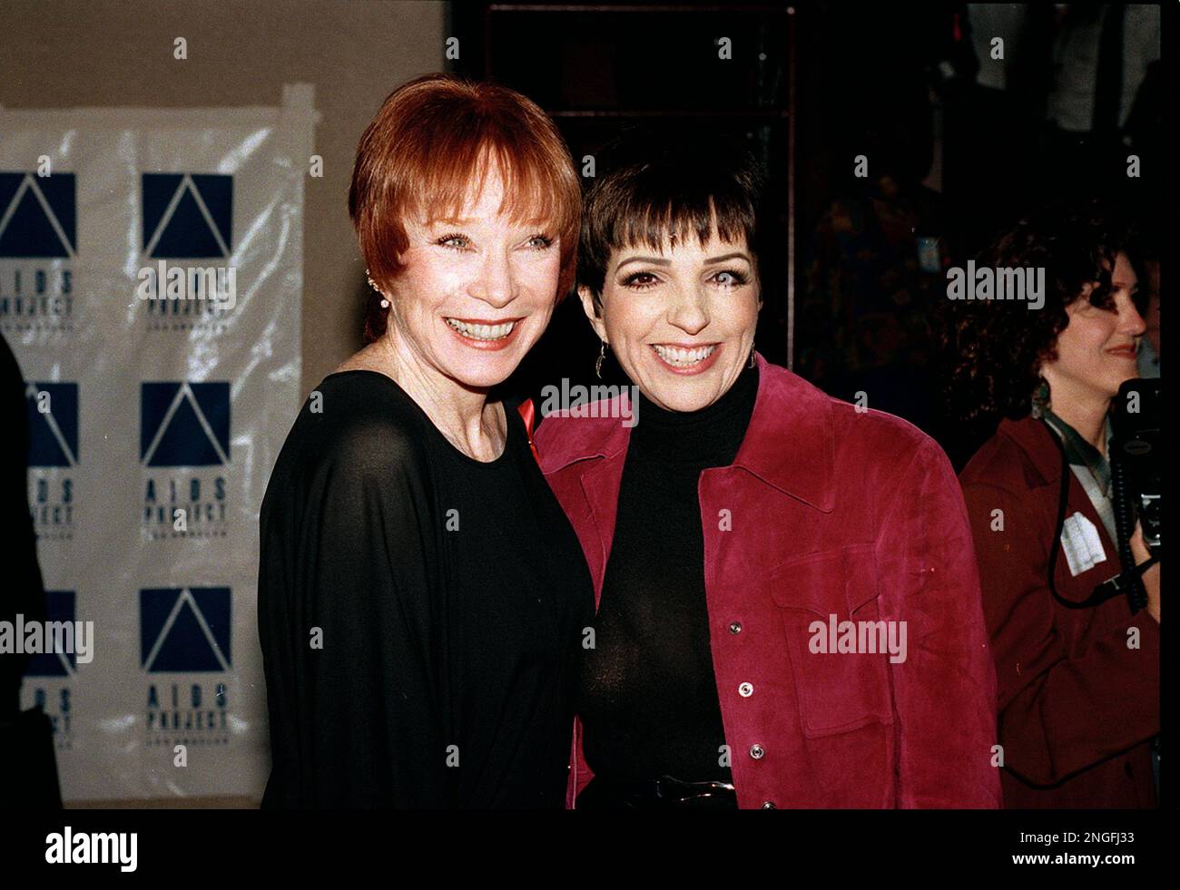 Actress Shirley Maclaine and singer Liza Minnelli share a moment during ...