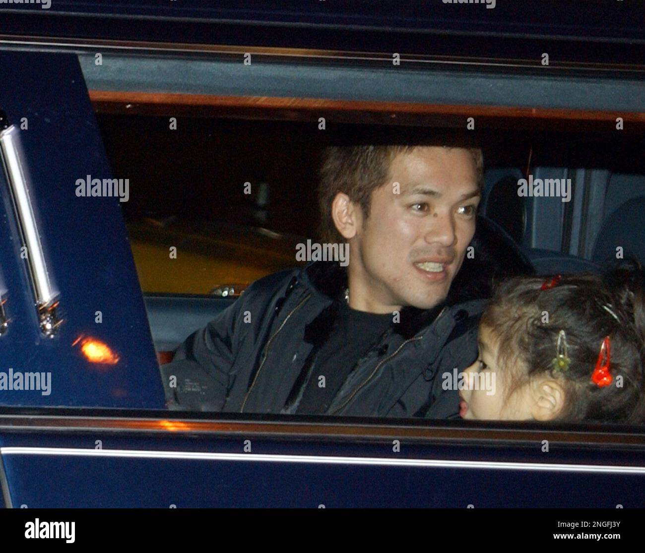 Japanese shortsop Kazuo Matsui and his daughter Haruna depart New York ...