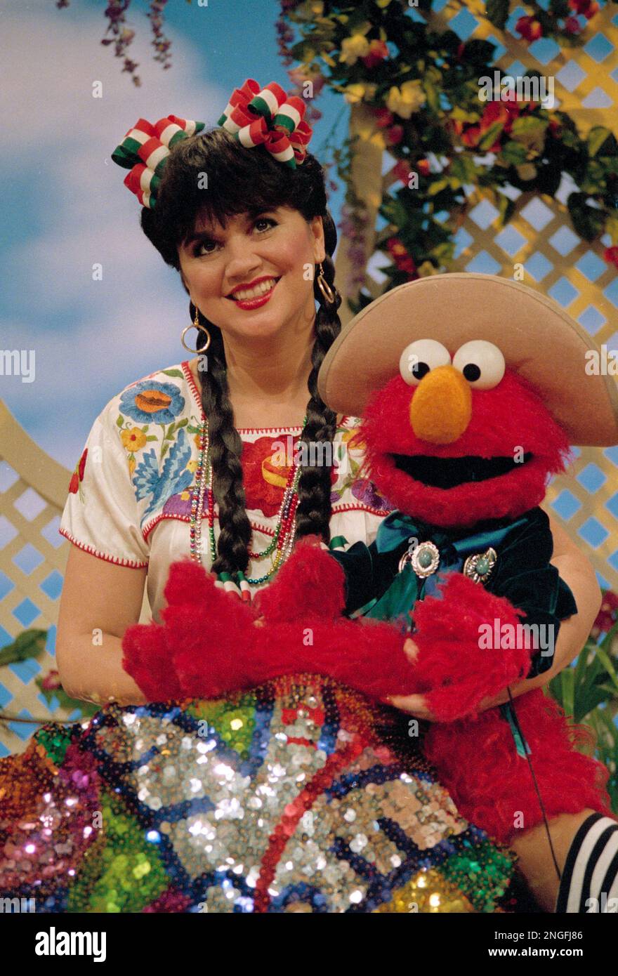 Singer Linda Ronstadt poses with a mariachi puppet during the taping of ...