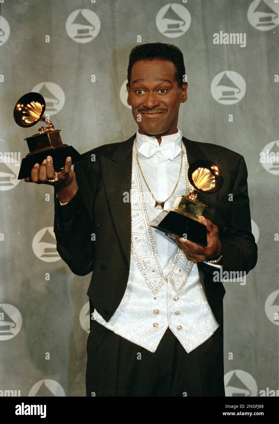 R&B Singer Luther Vandross poses with his awards at the 1992 Grammy ...