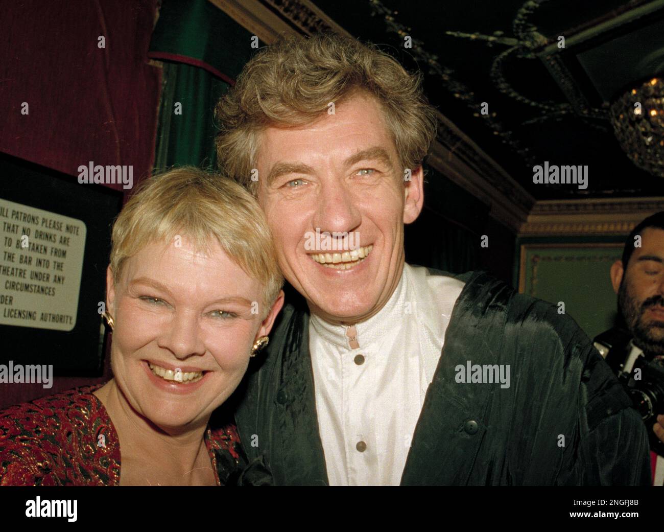 Actress Judi Dench is congratulated by actor Ian McKellen after winning ...