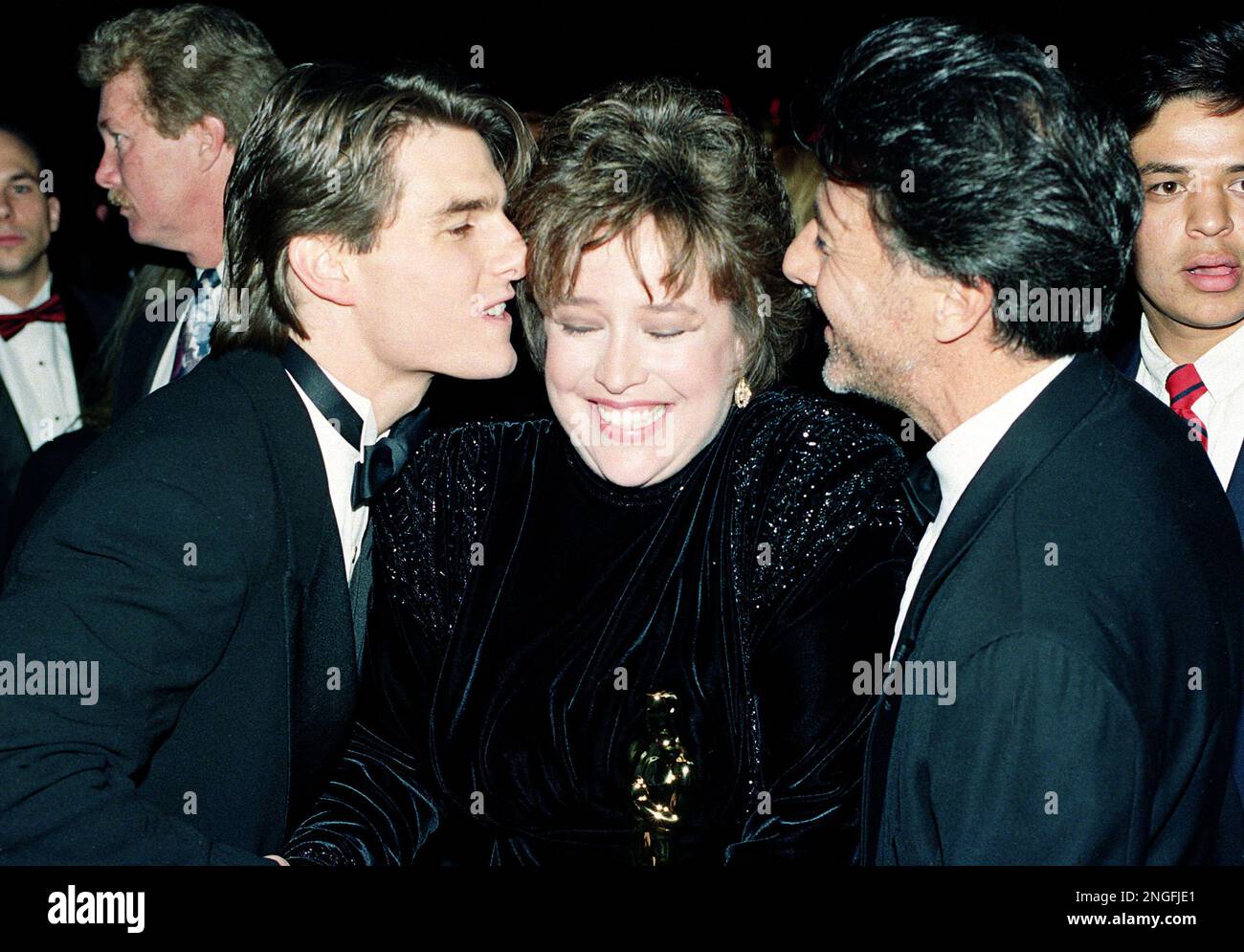 Actors Tom Cruise, left, and Dustin Hoffman kiss Oscar winner Kathy ...