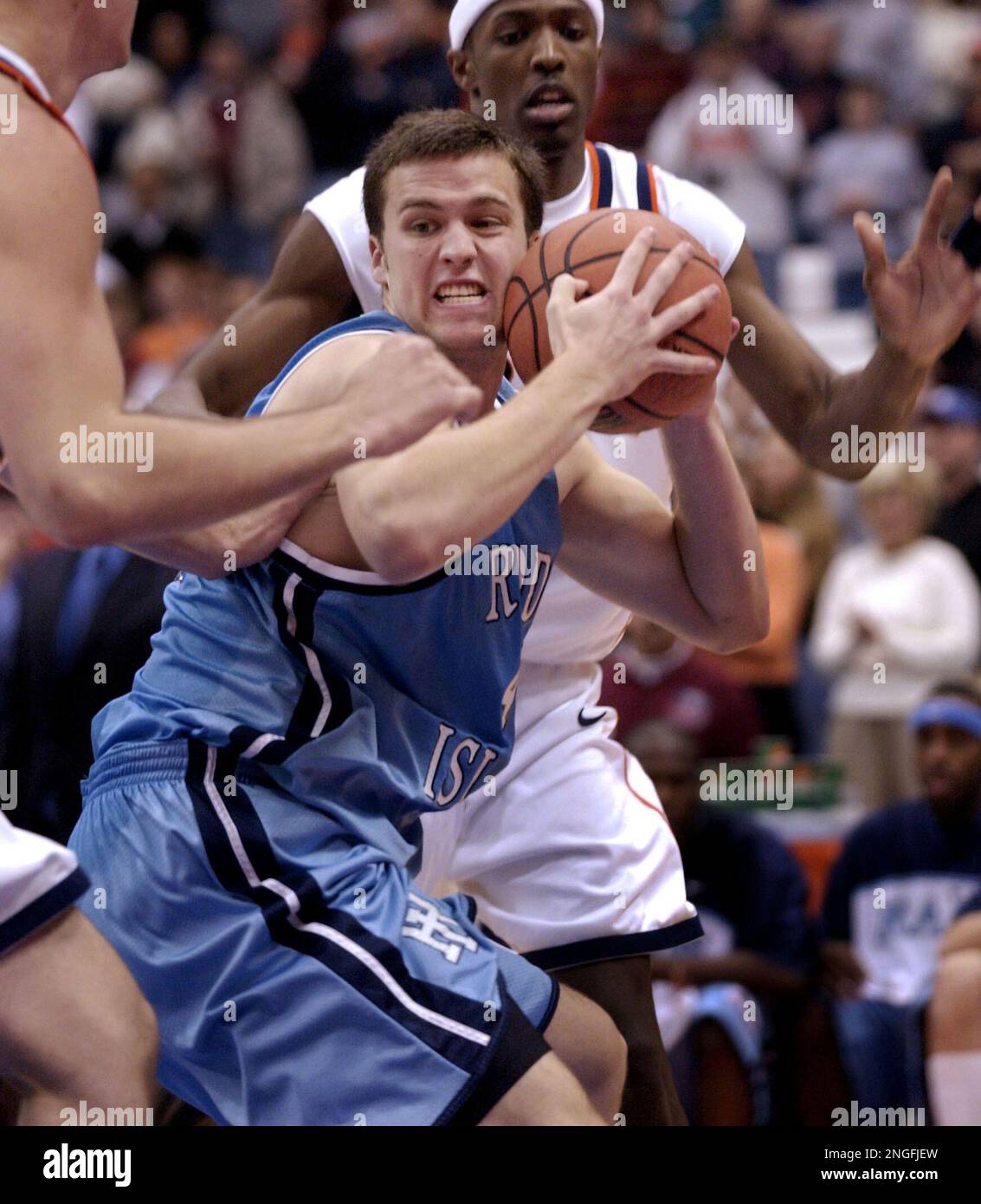 Rhode Island's Jon Clark pulls down a rebound between Syracuse's Hakim ...
