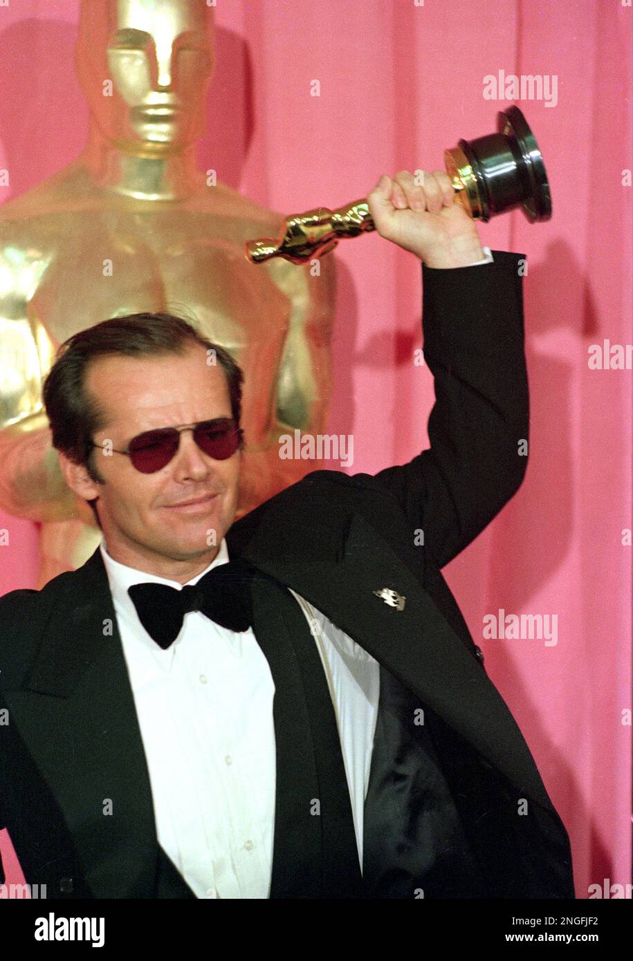 Actor Jack Nicholson holds the Oscar statuette he won for best actor ...