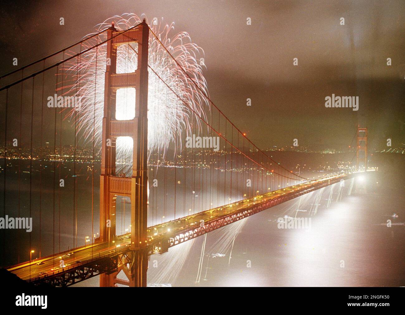 A waterfall of sparks showers down from the deck of the Golden Gate ...