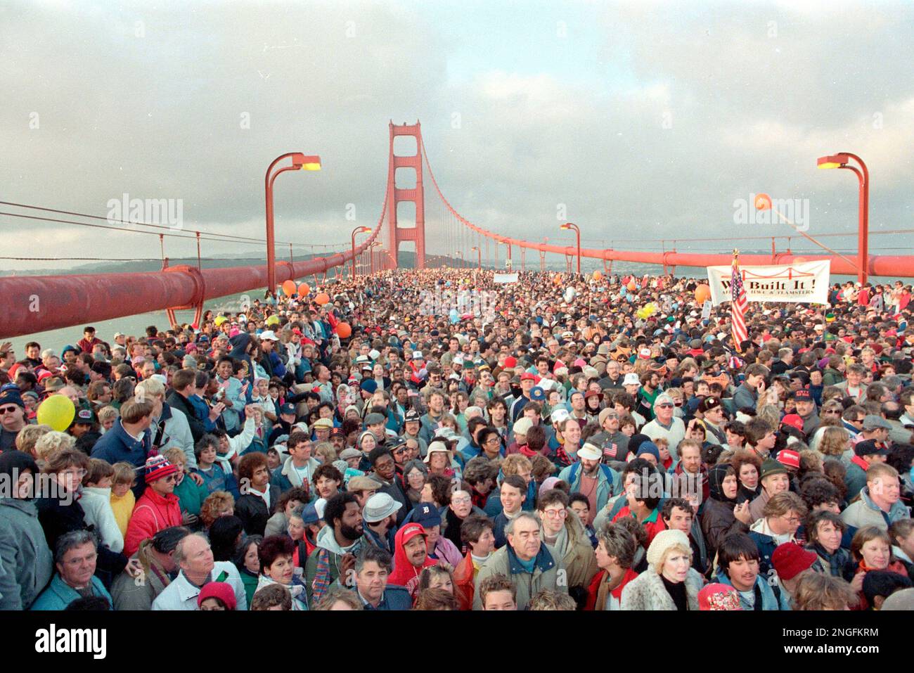 A crowd estimated at 800,000 jams the deck of the Golden Gate Bridge in ...