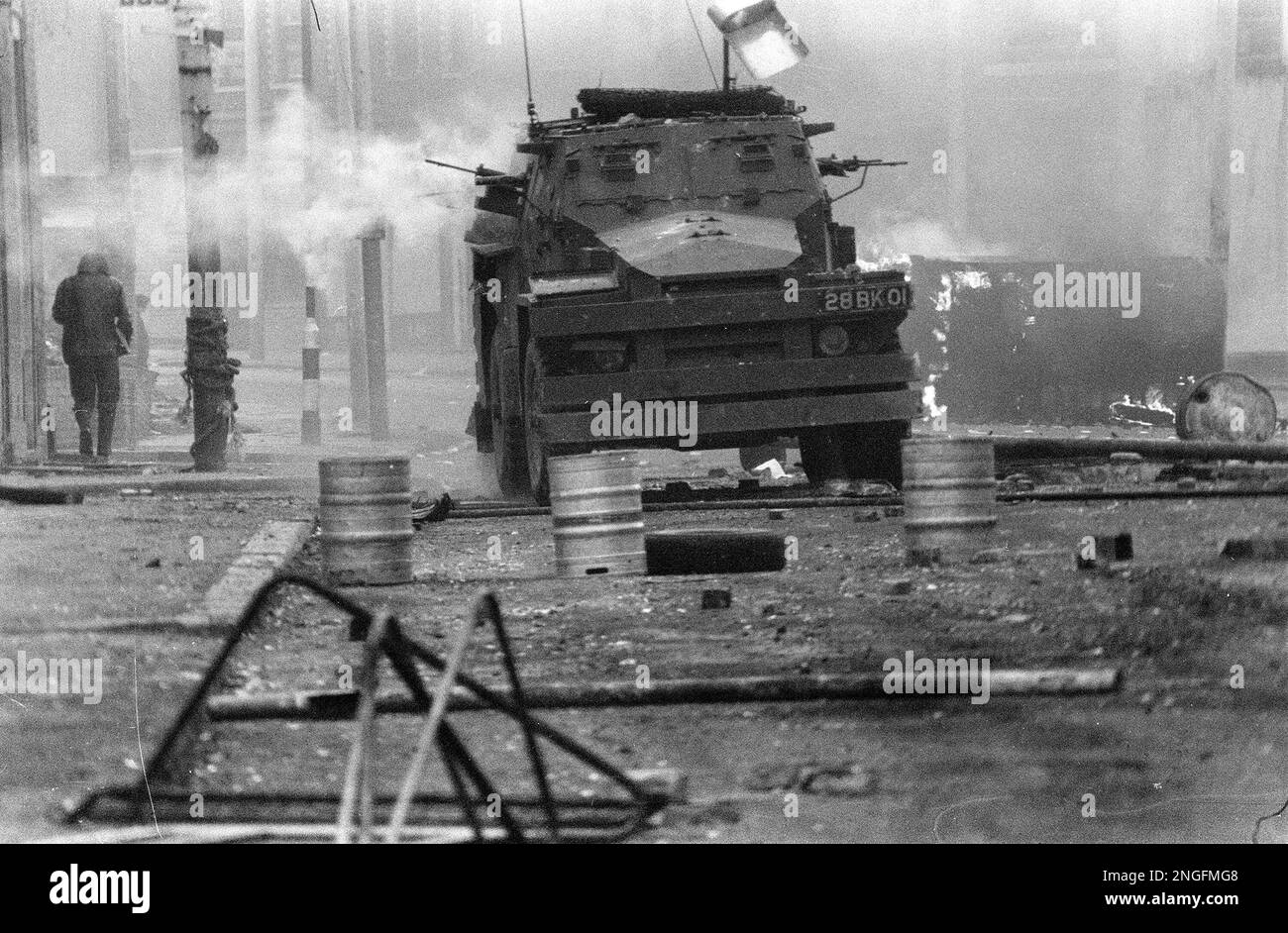 A British Army Saracen armoured vehicle makes its way along a barricade ...