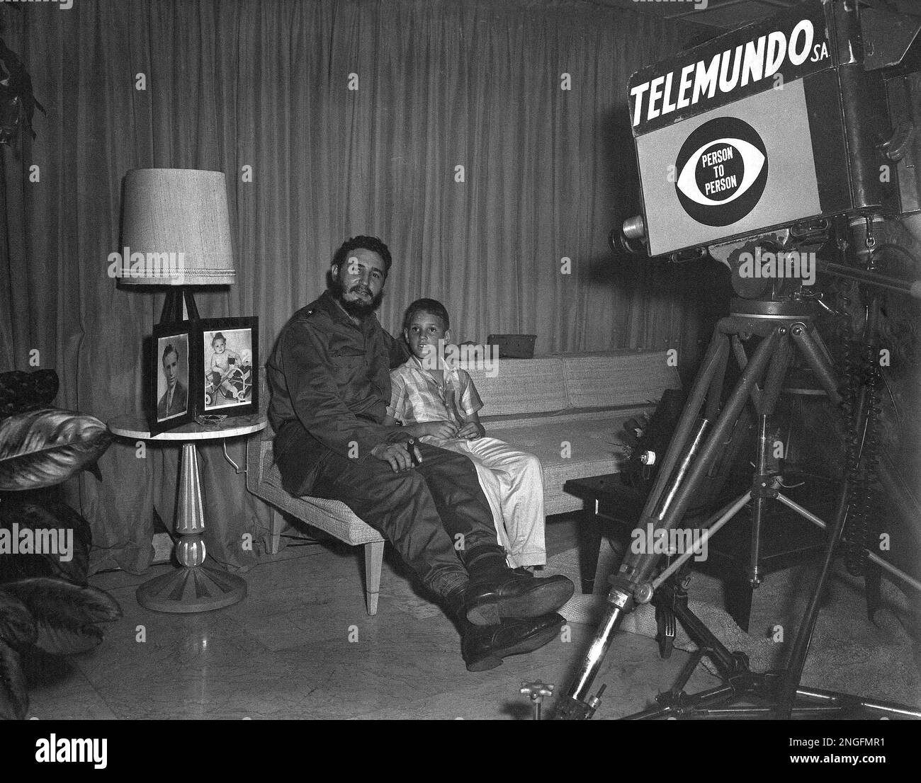 Cuba's revolutionary leader Fidel Castro sits with his nine-year-old ...