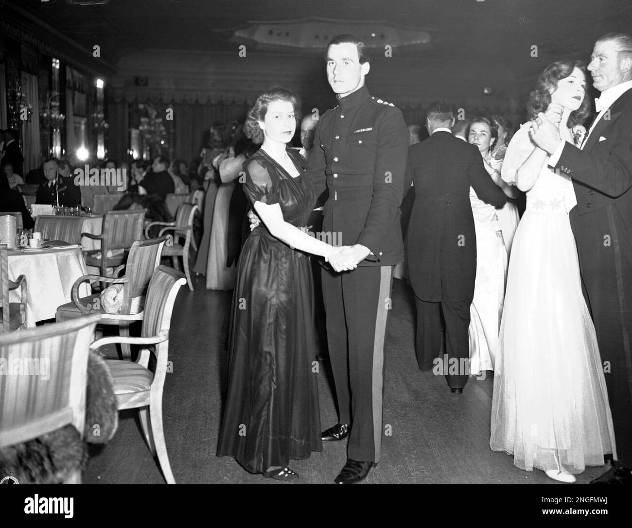 Britain's Princess Elizabeth, later Queen Elizabeth II, dances with ...