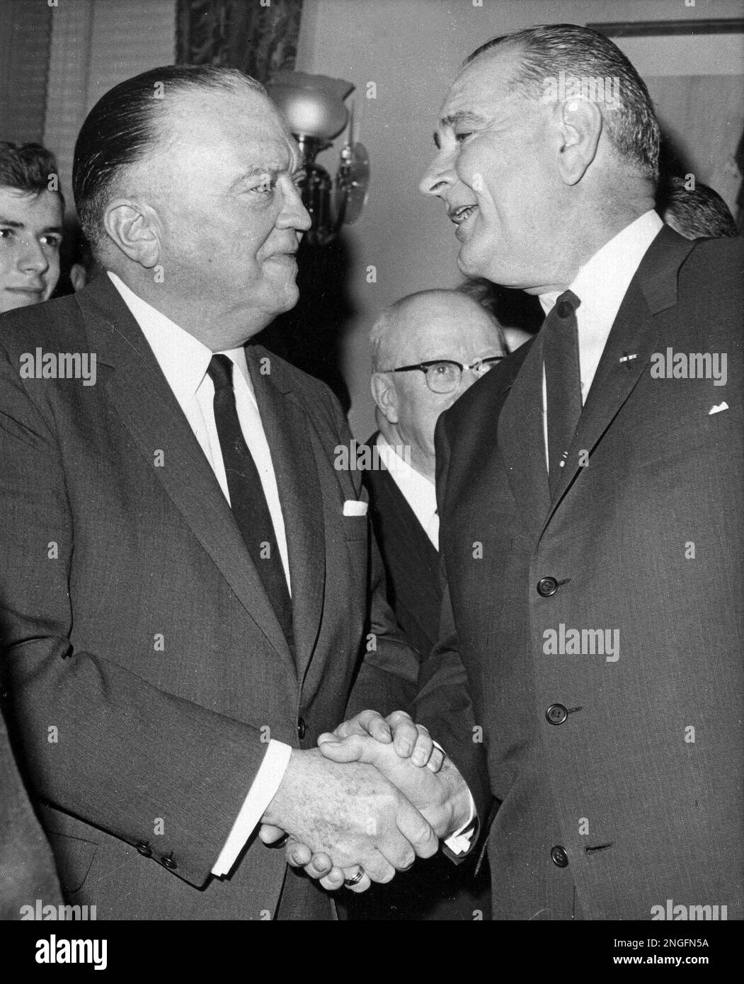 FBI director J. Edgar Hoover, left, shakes hands with U.S. President ...