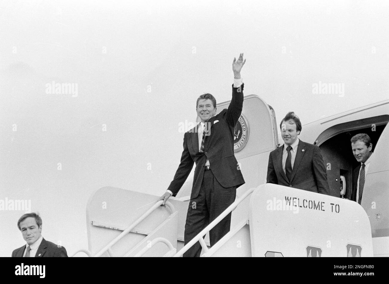U.S. President Ronald Reagan waves as he exits Air Force One after ...