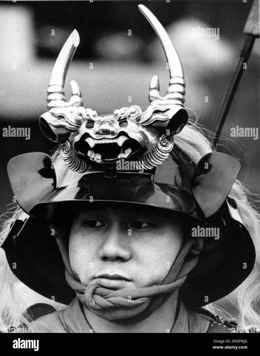 A member of the "Hundred Gunmen" wears traditional warrior armor and a ...