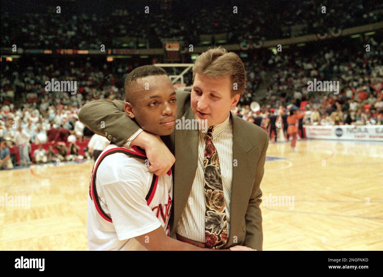 Cincinnati's coach Bob Huggins embraces senior guard Nick Van Exel after the Bearcats defeated ...