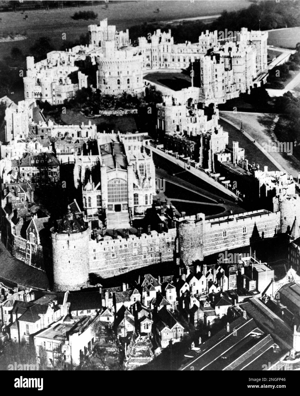 This aerial view shows the complex of Windsor Castle, principal ...