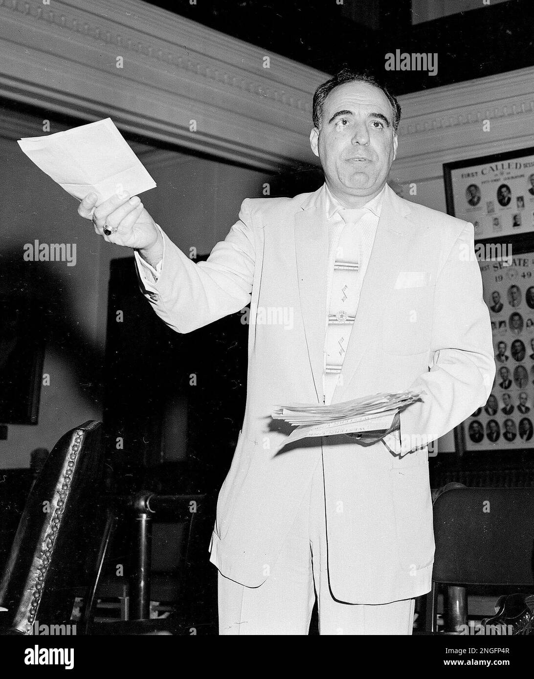 Sen. Henry B. Gonzalez of San Antonio, Texas, holds up a stack of ...