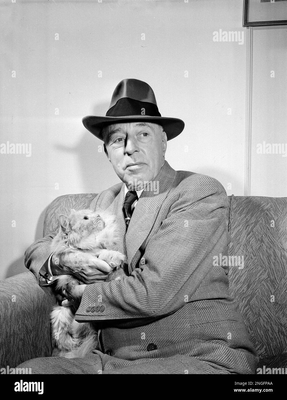 Film director and producer D.W. Griffith is shown with his cat in Los ...