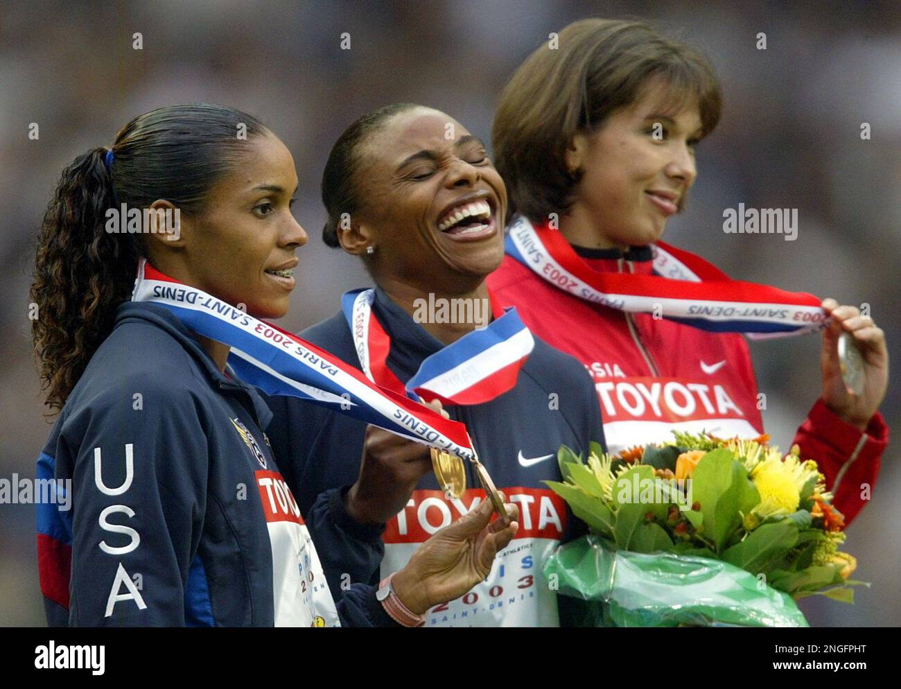 Bronze medalist Torri Edwards of the USA, gold medalist Kelli White of ...