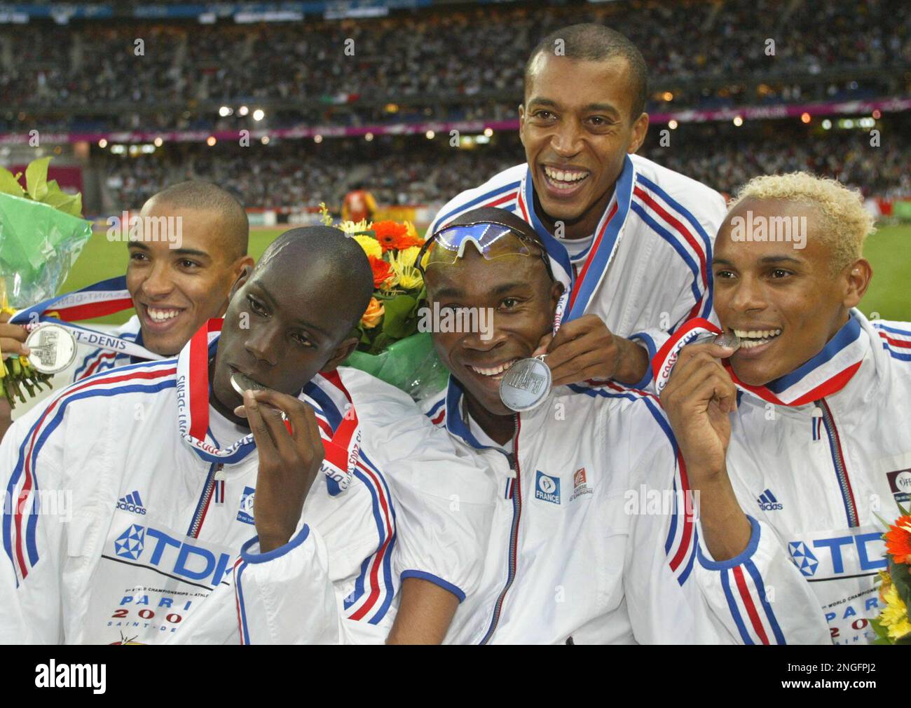 Members of the French relay team pose with the silver medals they won ...