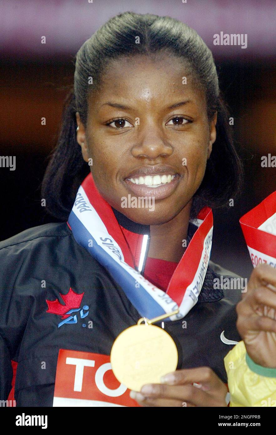 Perdita Felicien of Canada displays the gold medal she won in the Women ...