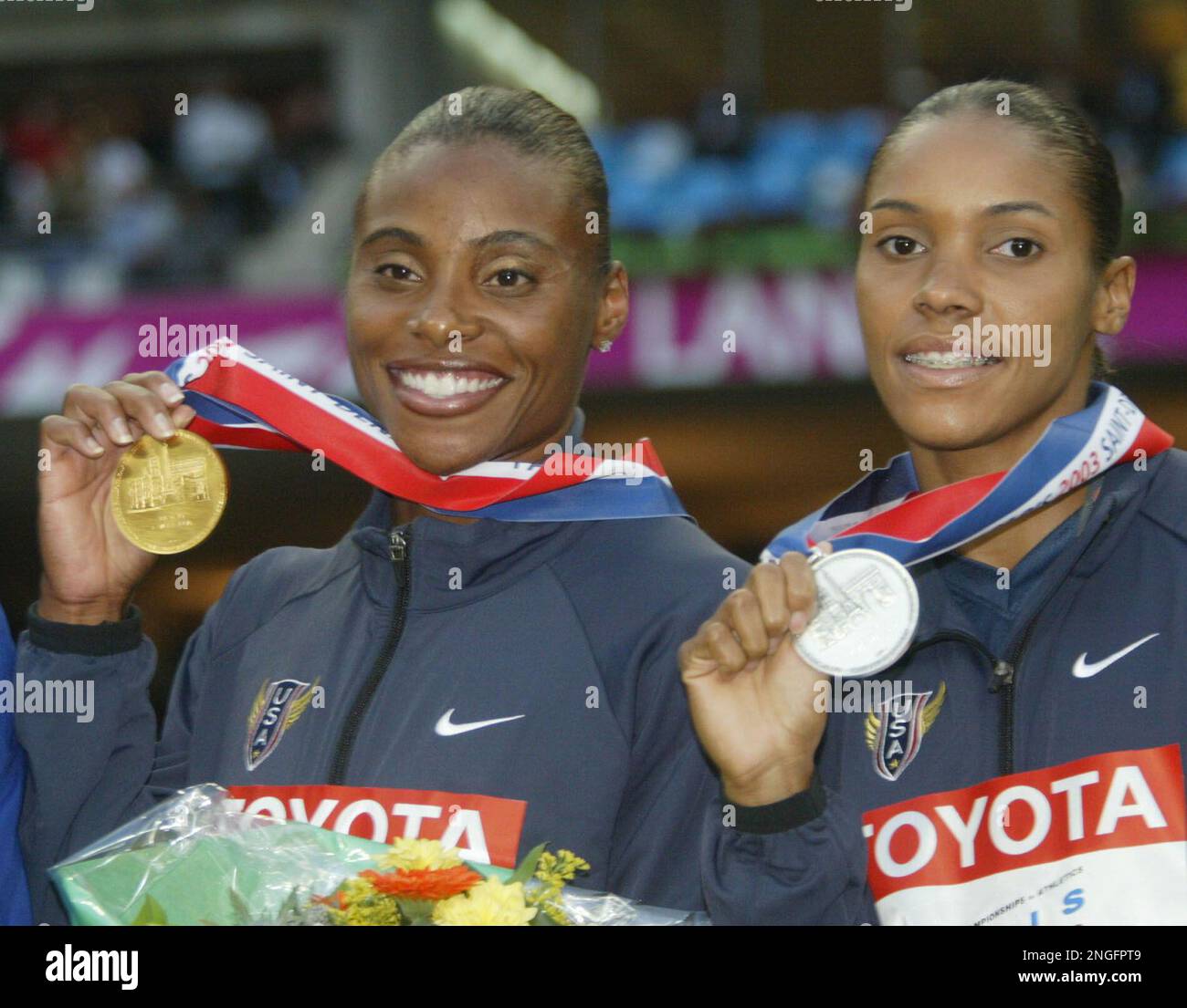 Gold medalist Kelli White of the U.S., left, and silver medalist Torri ...