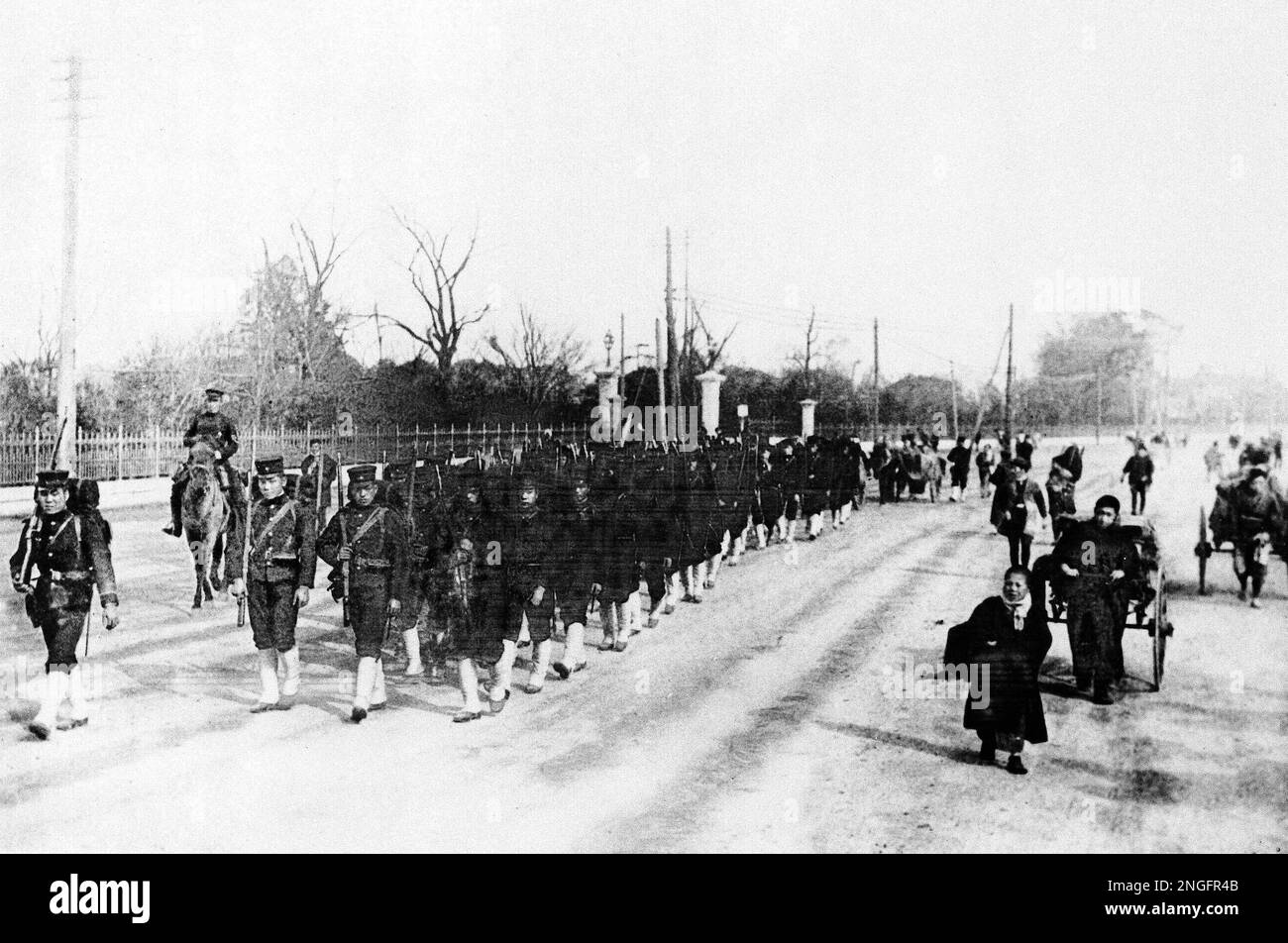 Japanese troops march in Tokyo, Japan, en route to railroad trains to ...