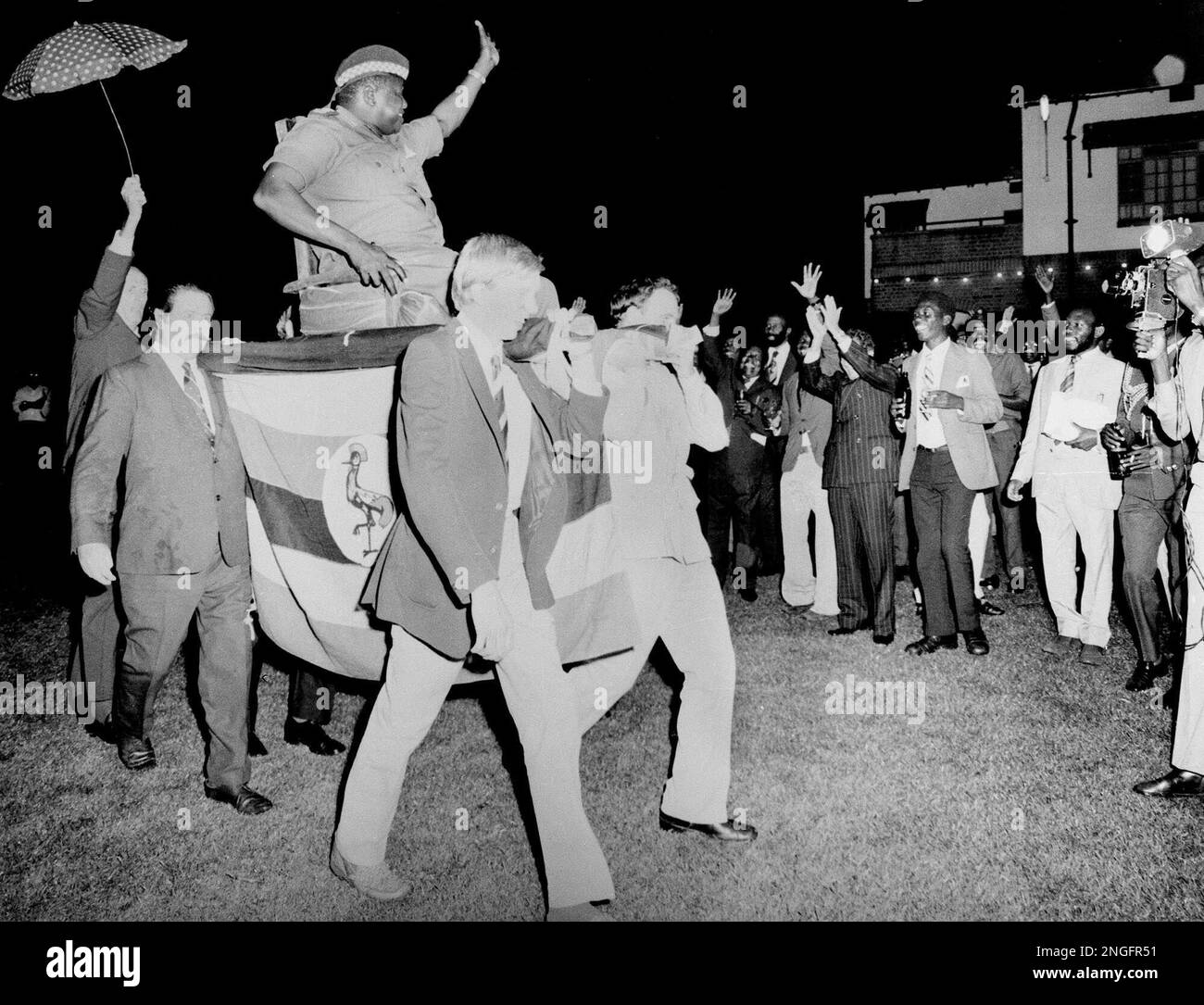 President of Uganda Idi Amin is carried in a chair by four British ...