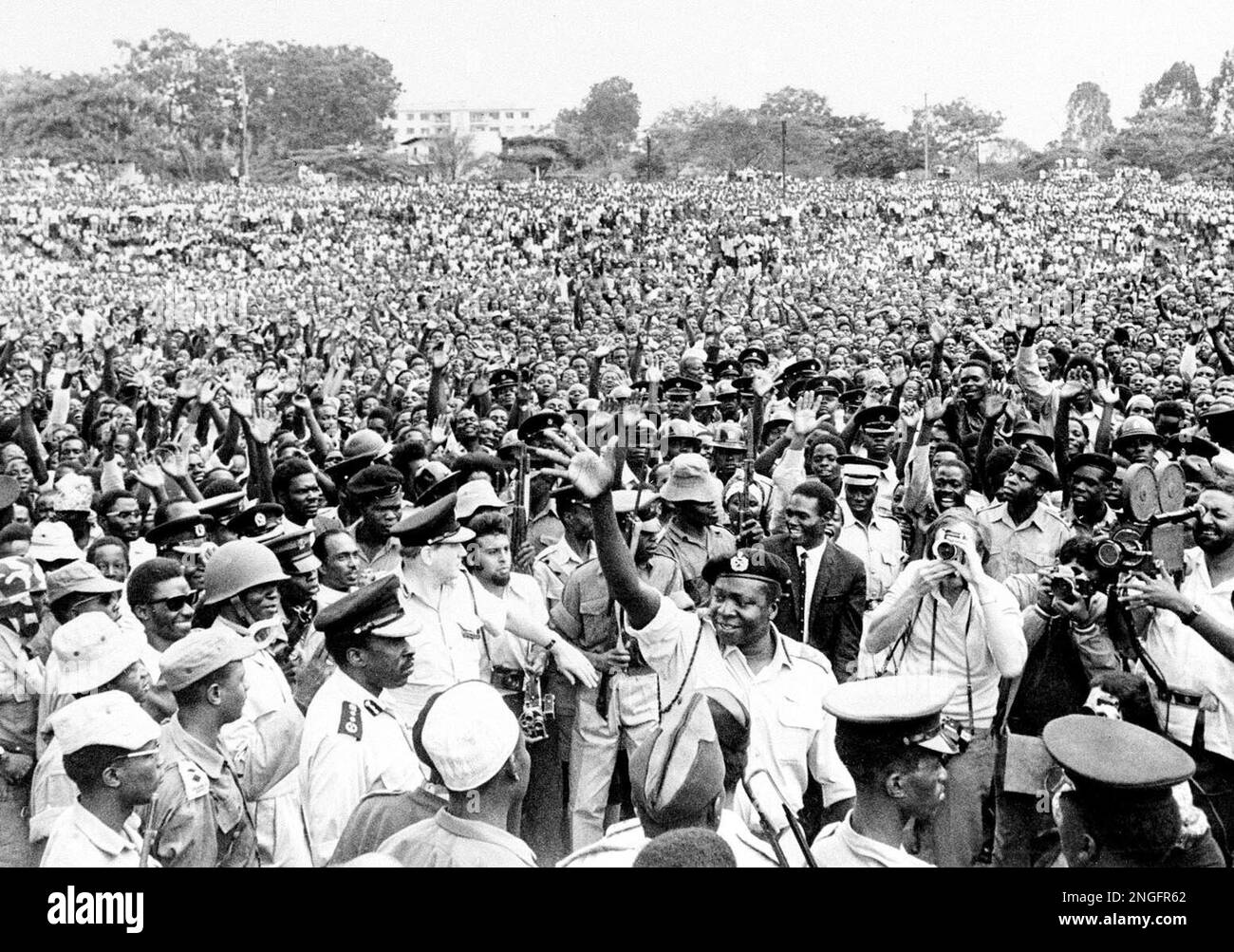Maj. Gen. Idi Amin waves to thousands of Ugandans gathered in a ...