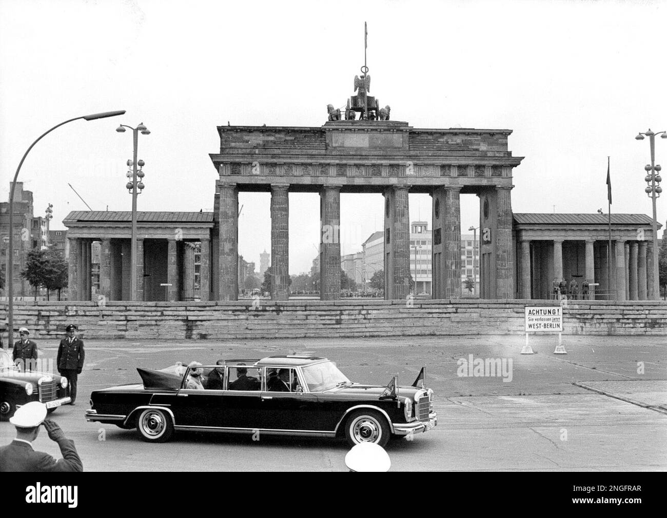 British Queen Elizabeth II and Prince Philip are sitting in a Mercedes ...
