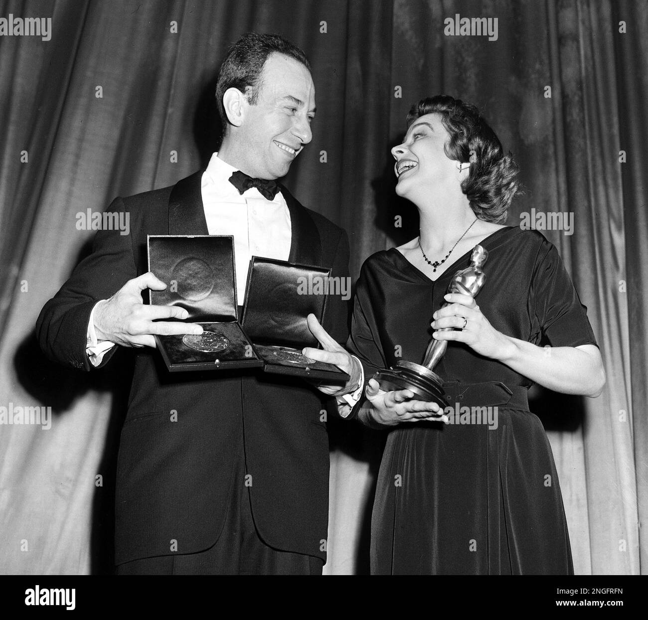 Director, writer and actor Jose Ferrer, holding his two Tony awards ...