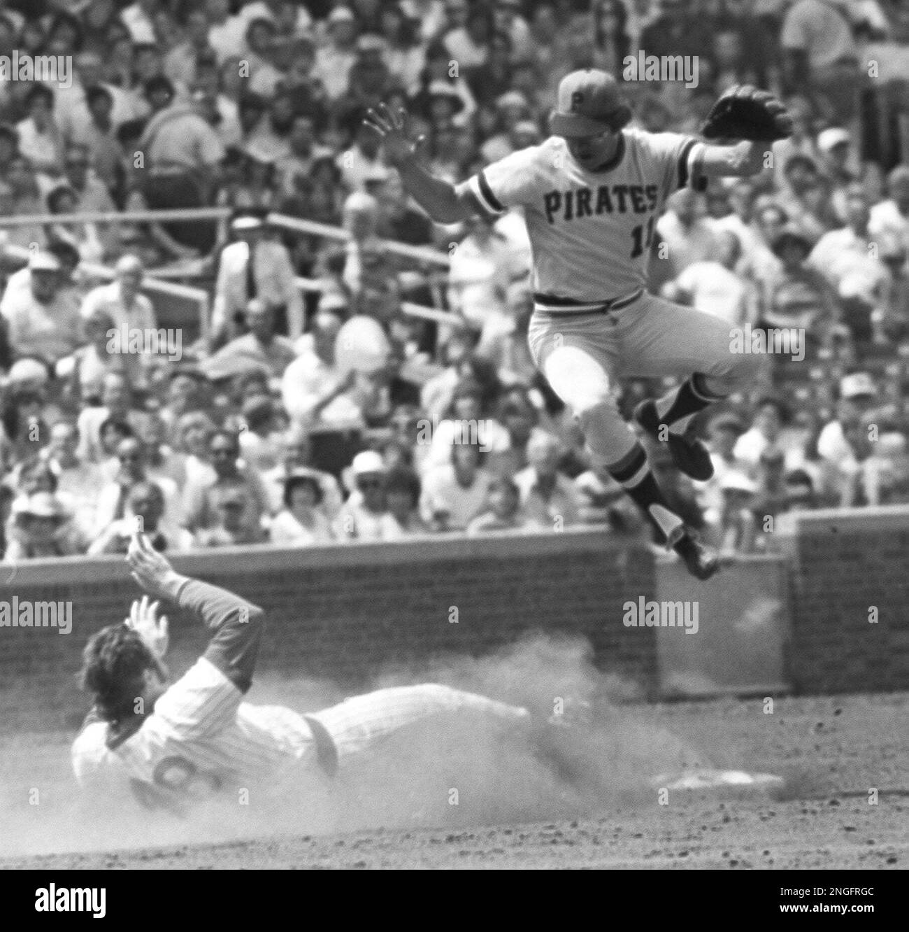 Pittsburgh Pirates second baseman Mario Mendoza leaps to field a throw ...