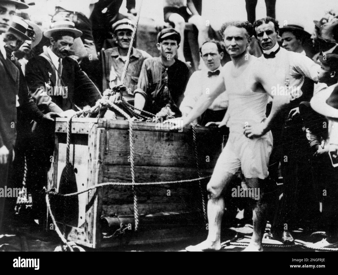 Escape artist Harry Houdini is shown before being lowered in a packing ...