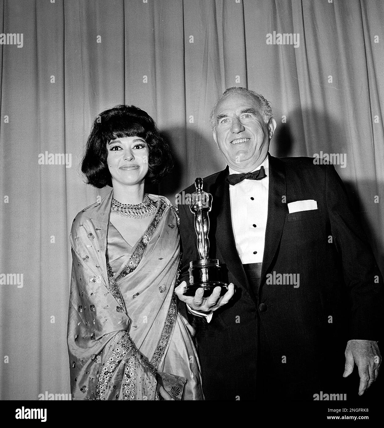 Oscar winner Ed Begley poses with presenter and actress Rita Moreno ...
