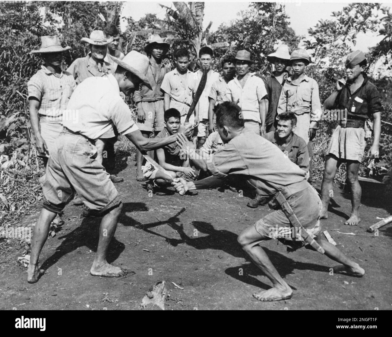 Filipino guerrillas, fighting with U.S. troops on Leyte Island, sharpen ...