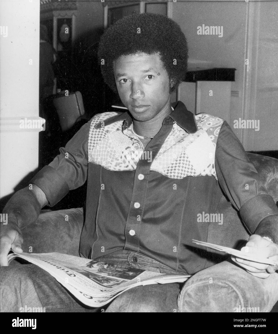 American tennis star Arthur Ashe relaxes in the lounge of his London ...
