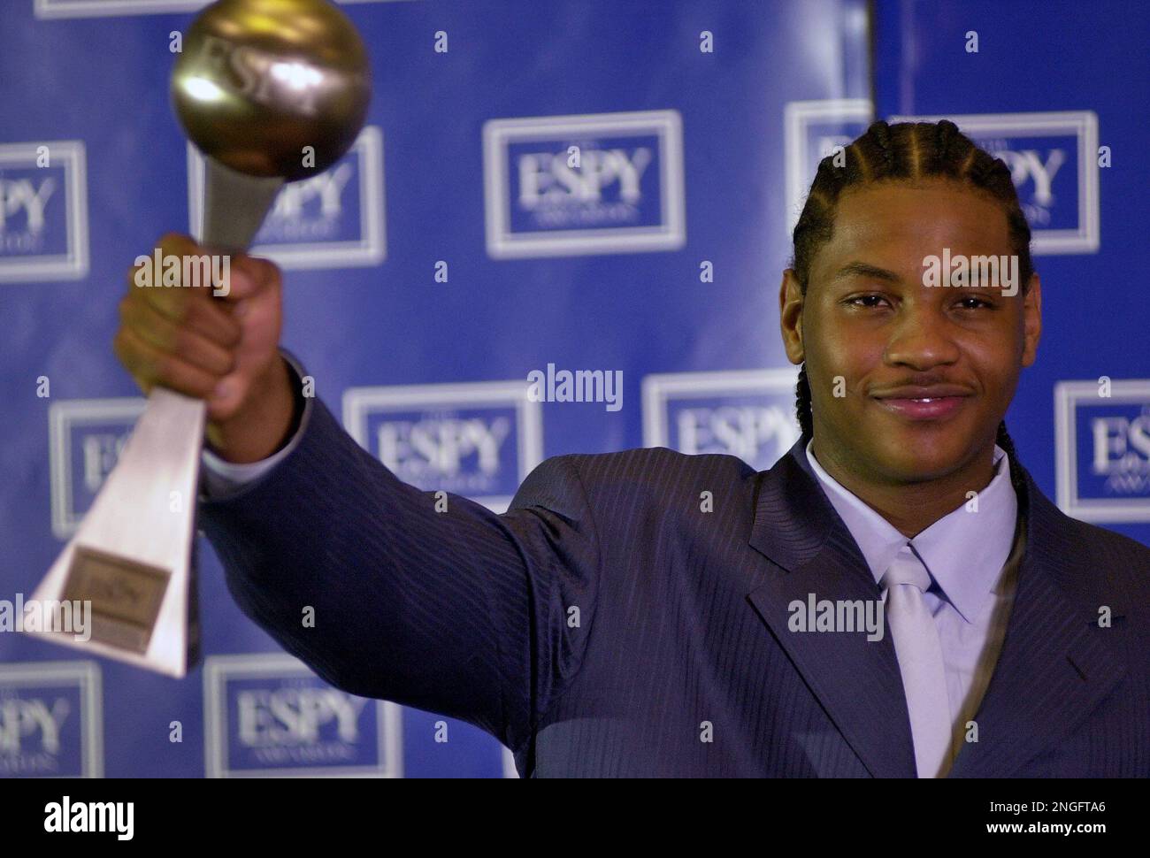 Denver Nuggets basketball player Carmelo Anthony raises the ESPY trophy ...