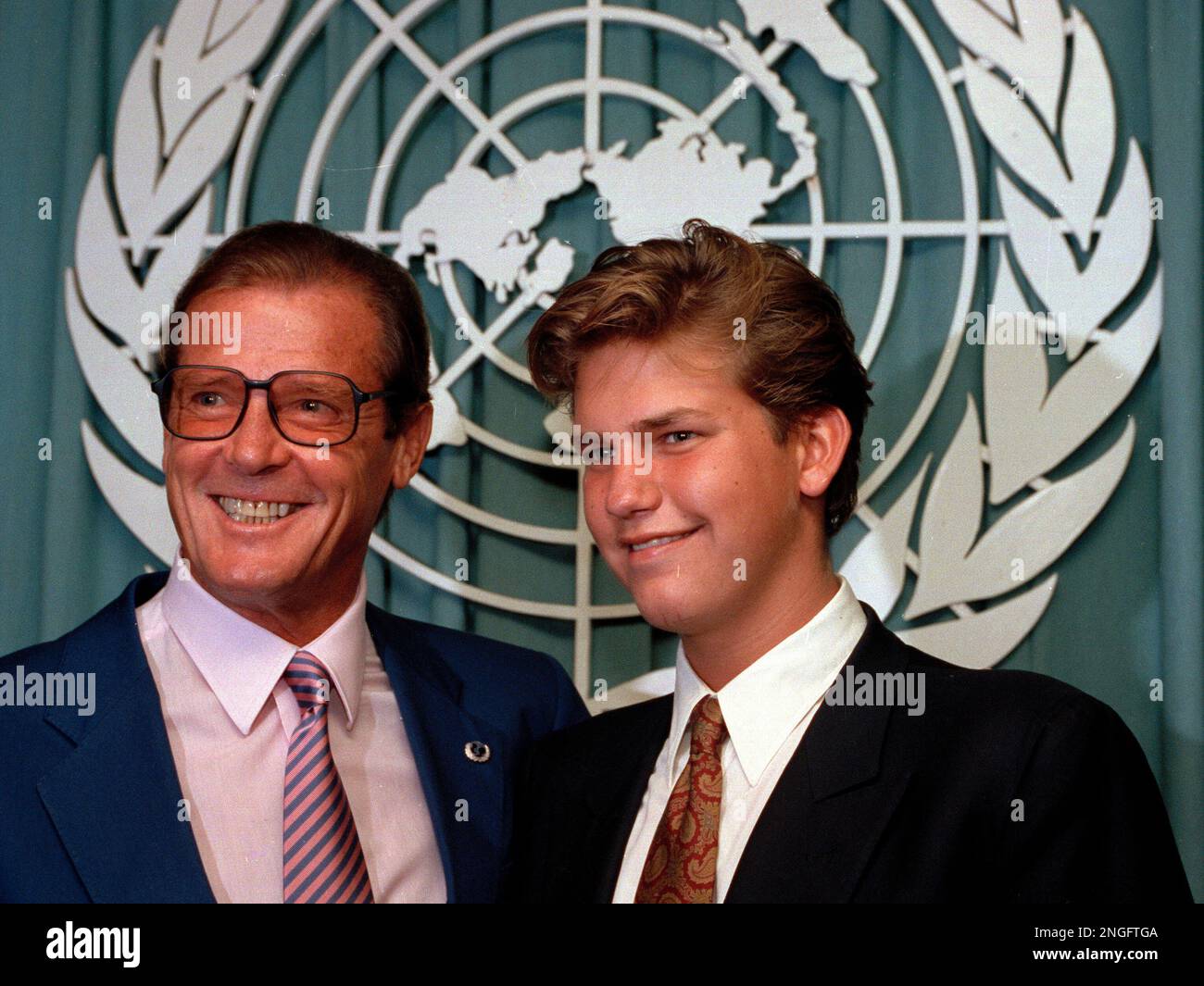British actor Roger Moore poses with his son, Christian, after UNICEF ...