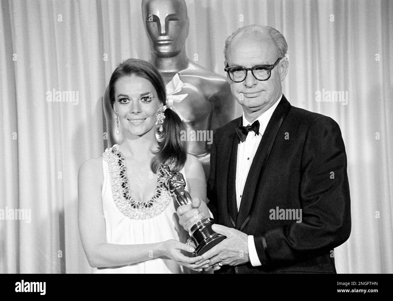 Oscar winner L.B. Abbott, right, poses with presenter Natalie Wood at ...