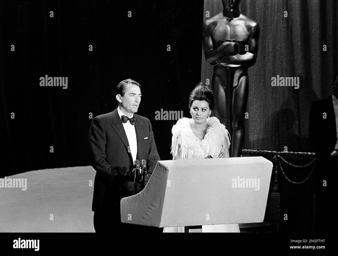 Gregory Peck, left, makes his acceptance speech after winning the best ...