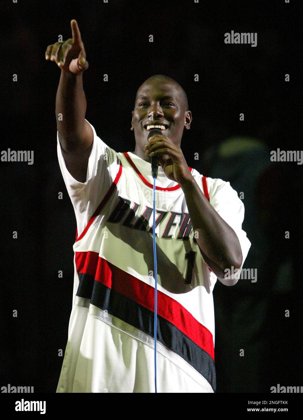 Tyrese sings the national anthem during a basketball exhibition Sunday ...