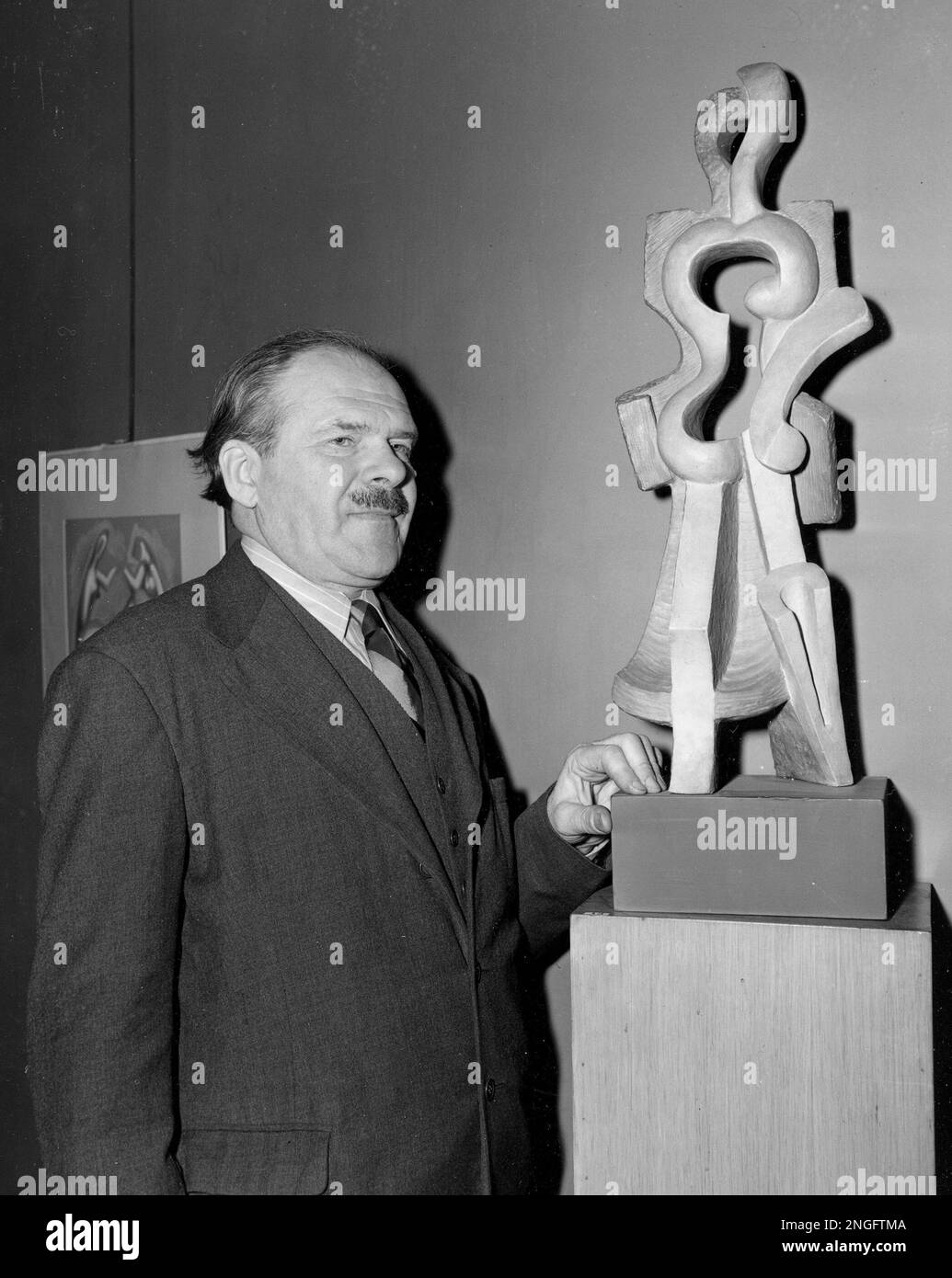 Alexander Archipenko Stands Beside One Of His Painted Terra Cotta