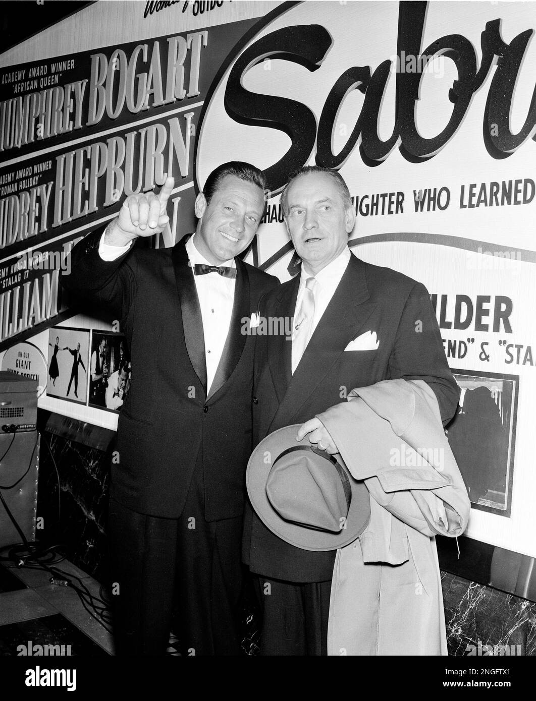 Actors William Holden and Fredric March arrive for the premiere of the ...