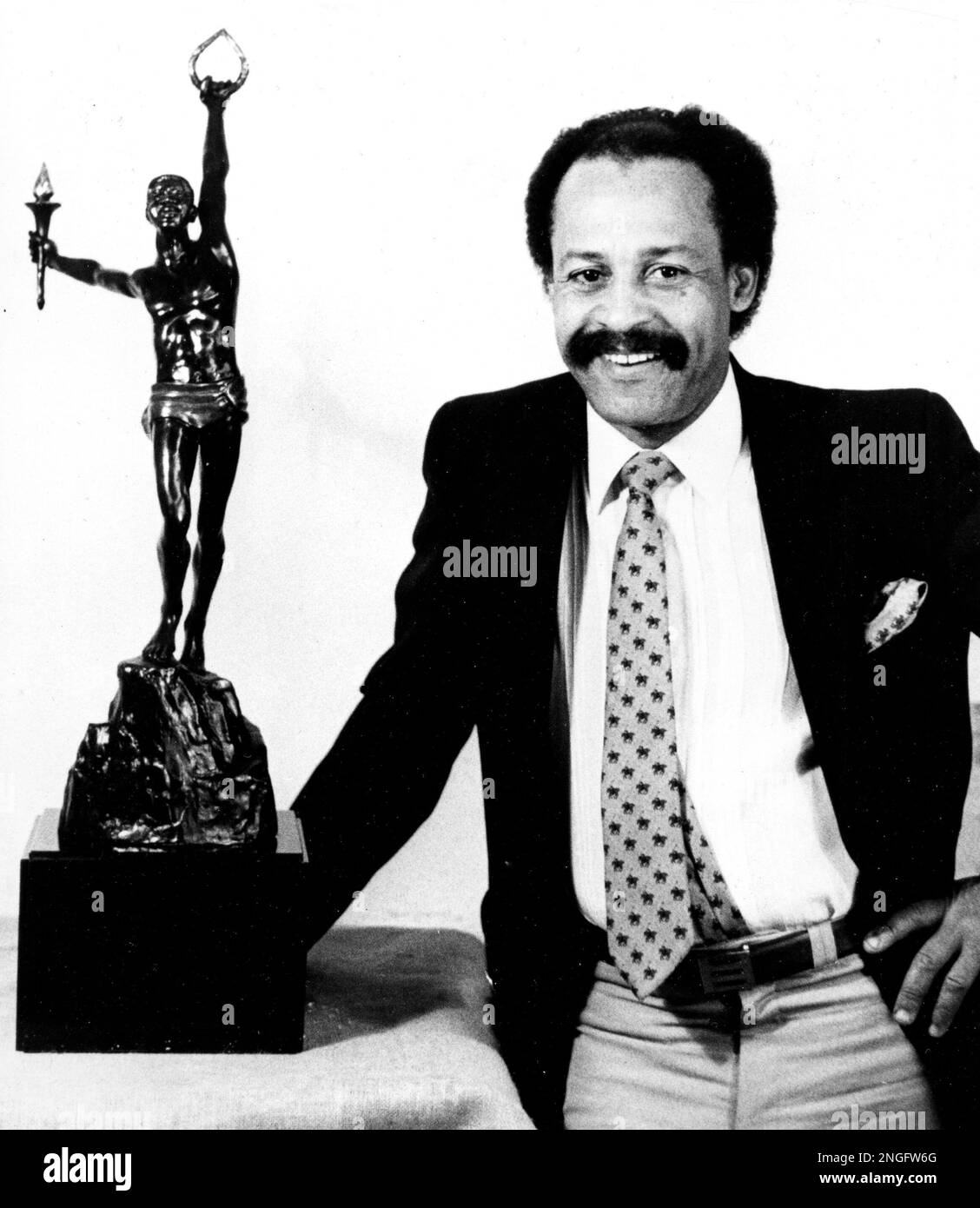 Sculptor Ed Dwight, the nation's first black astronaut, stands next to ...