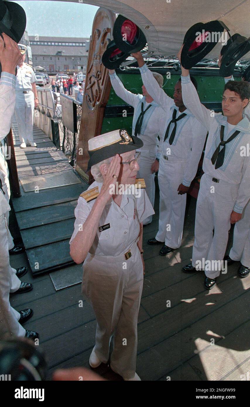 Rear Admiral Grace Hopper is saluted by crew members aboard the USS ...