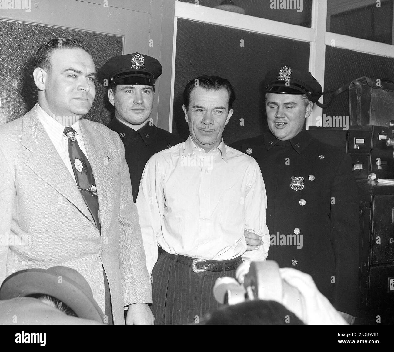 Bank robber Willie "the Actor" Sutton is brought into police ...